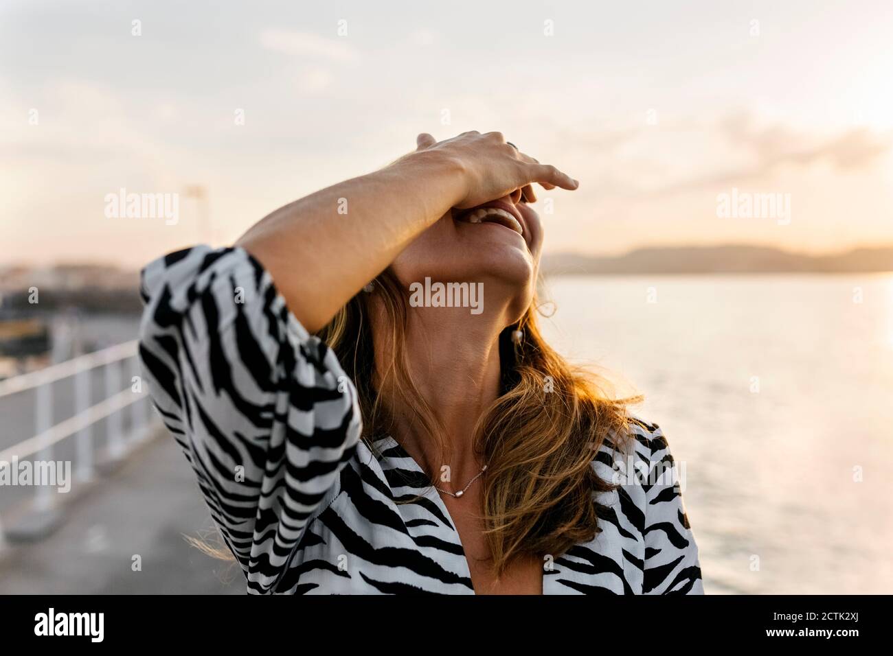 Hand against face hi-res stock photography and images - Alamy