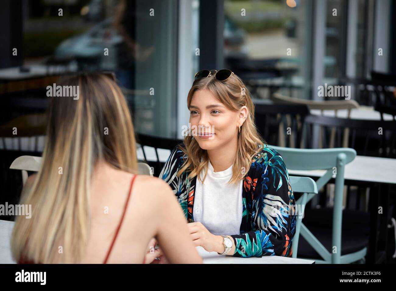Female friends meeting in a cafe Stock Photo - Alamy
