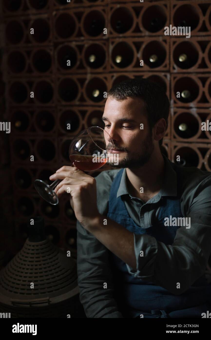 Young black man holding wine hi-res stock photography and images - Alamy