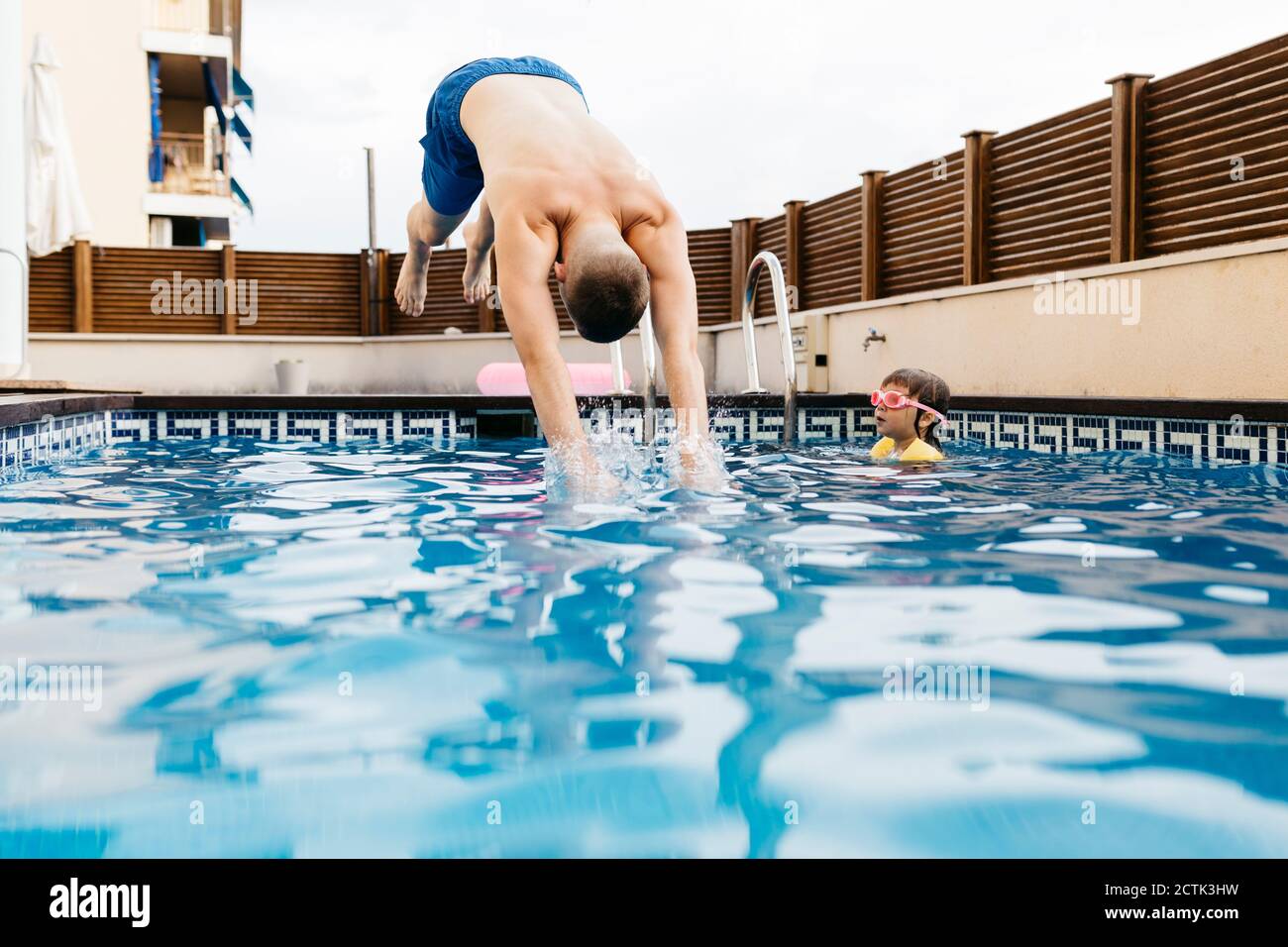 Man jumping swimming pool hi-res stock photography and images - Alamy