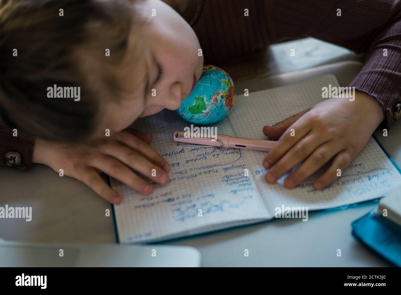 Girl sleeping on table hi-res stock photography and images - Alamy
