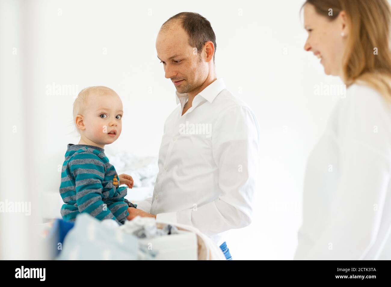 Family dressing up smiling hi-res stock photography and images - Alamy