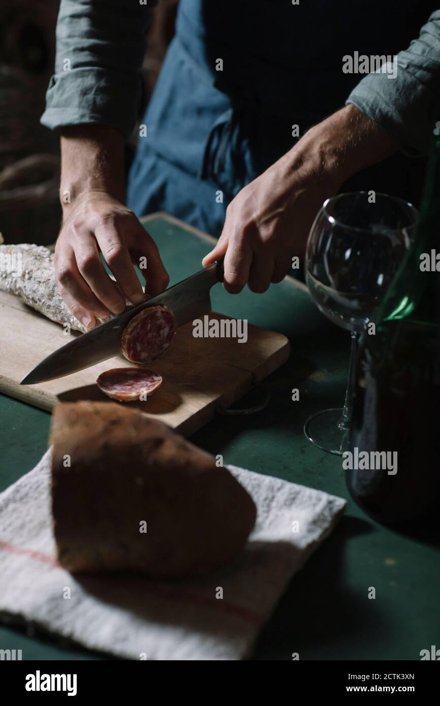 Man cutting meat hi-res stock photography and images - Alamy