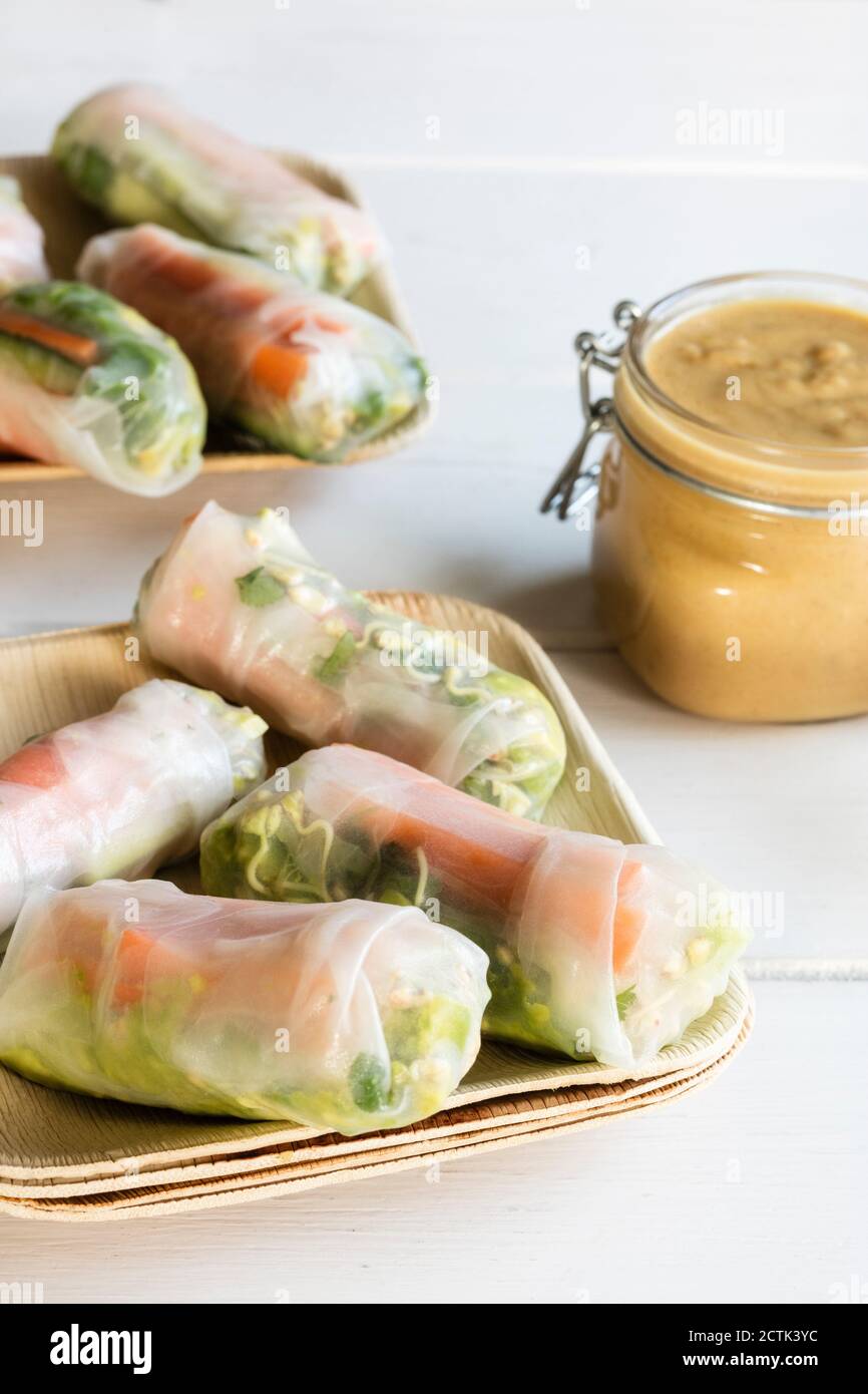 Spring rolls with jar of peanut dip Stock Photo - Alamy