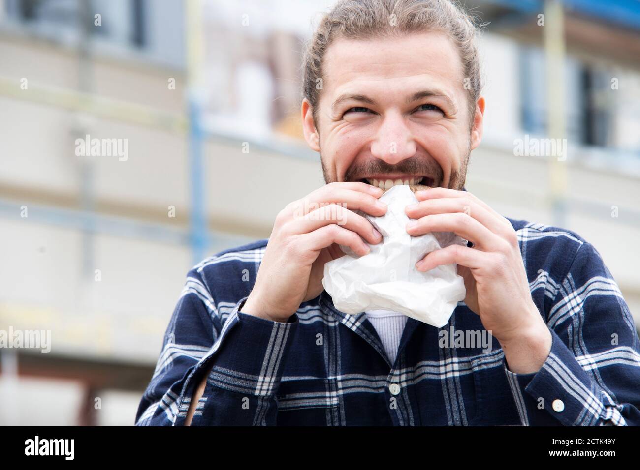 Man eating with bread hi-res stock photography and images - Alamy