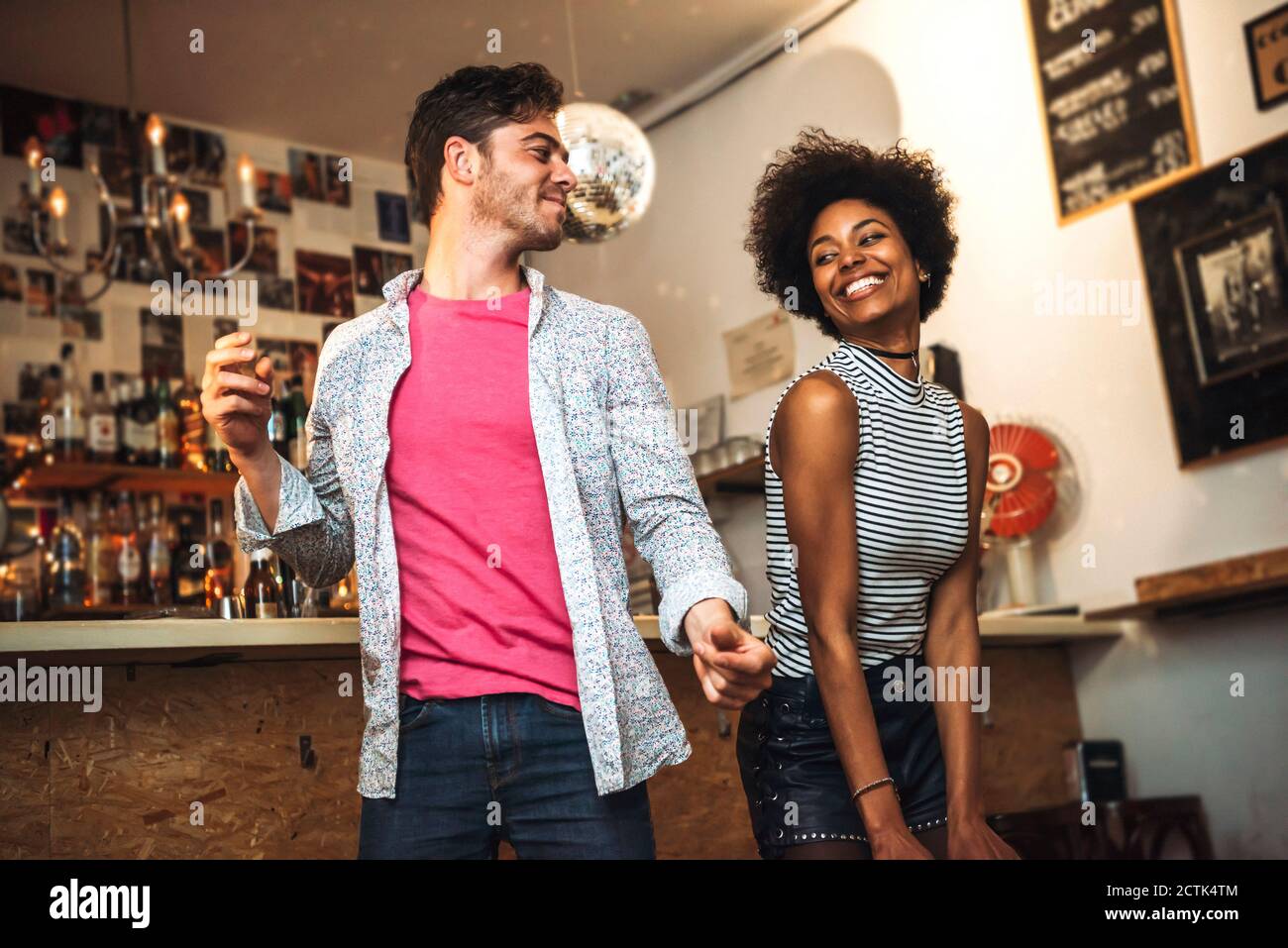Cheerful couple dancing in nightclub Stock Photo - Alamy