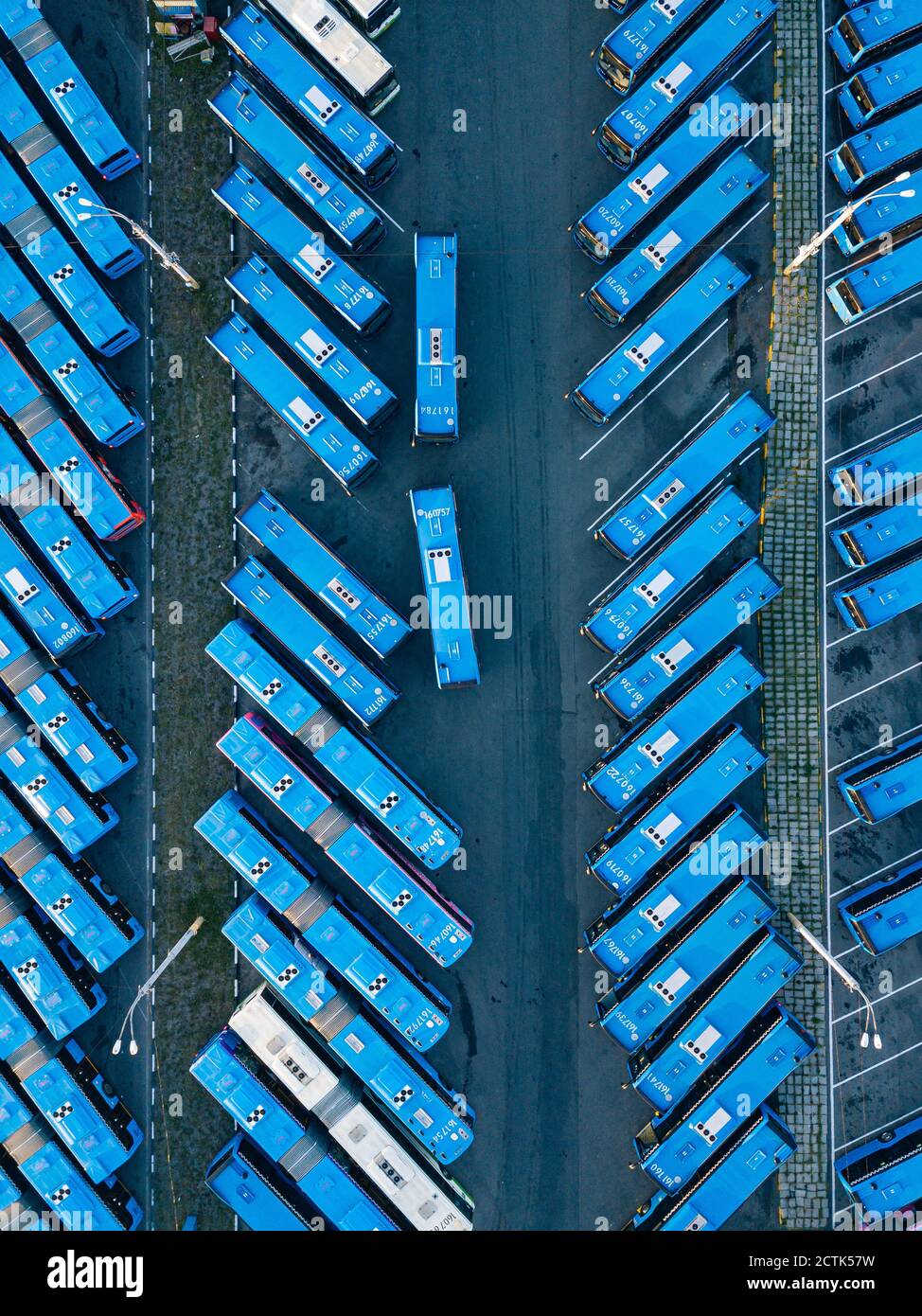 Aerial view of parking lot filled with blue buses Stock Photo - Alamy