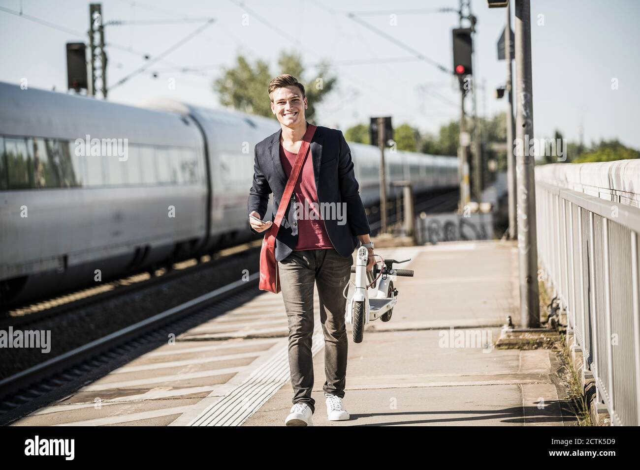 Man walking on train platform hi-res stock photography and images - Alamy