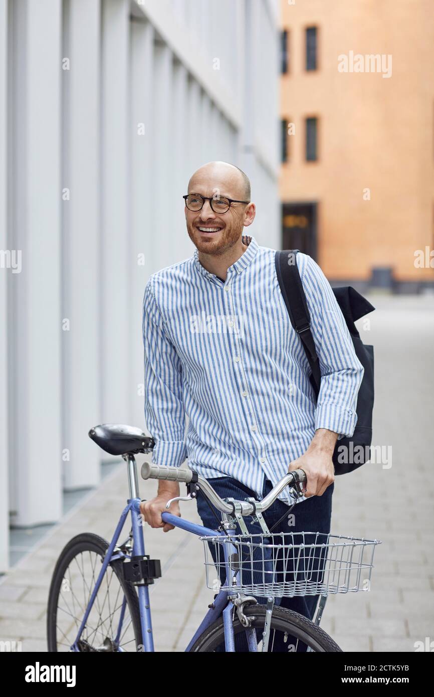 Bald businessman bicycle hi-res stock photography and images - Alamy