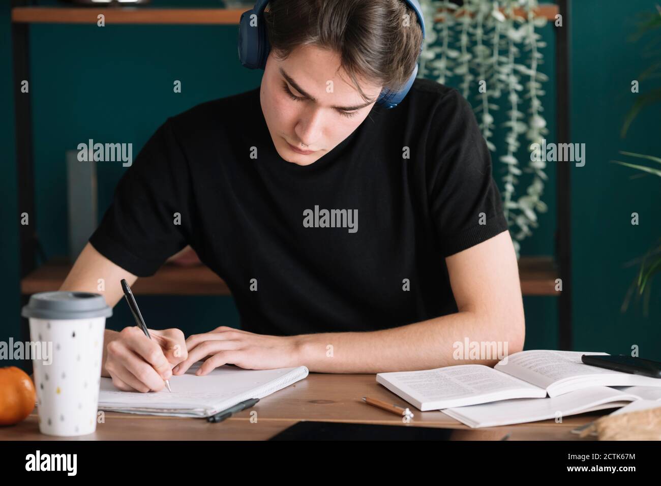 Man writing in book hi-res stock photography and images - Alamy