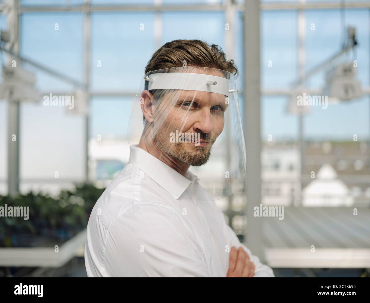 Wearing face shield hi-res stock photography and images - Alamy