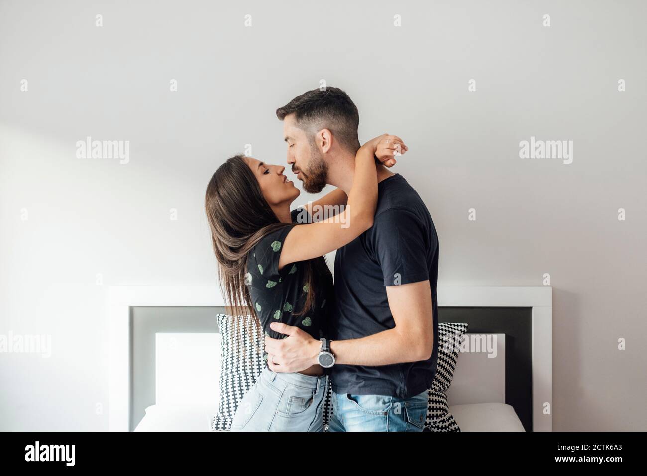 Kneeling on bed hi-res stock photography and images - Alamy