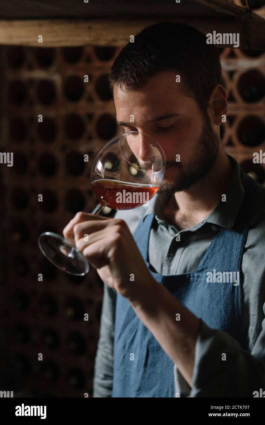 Young black man holding wine hi-res stock photography and images - Alamy