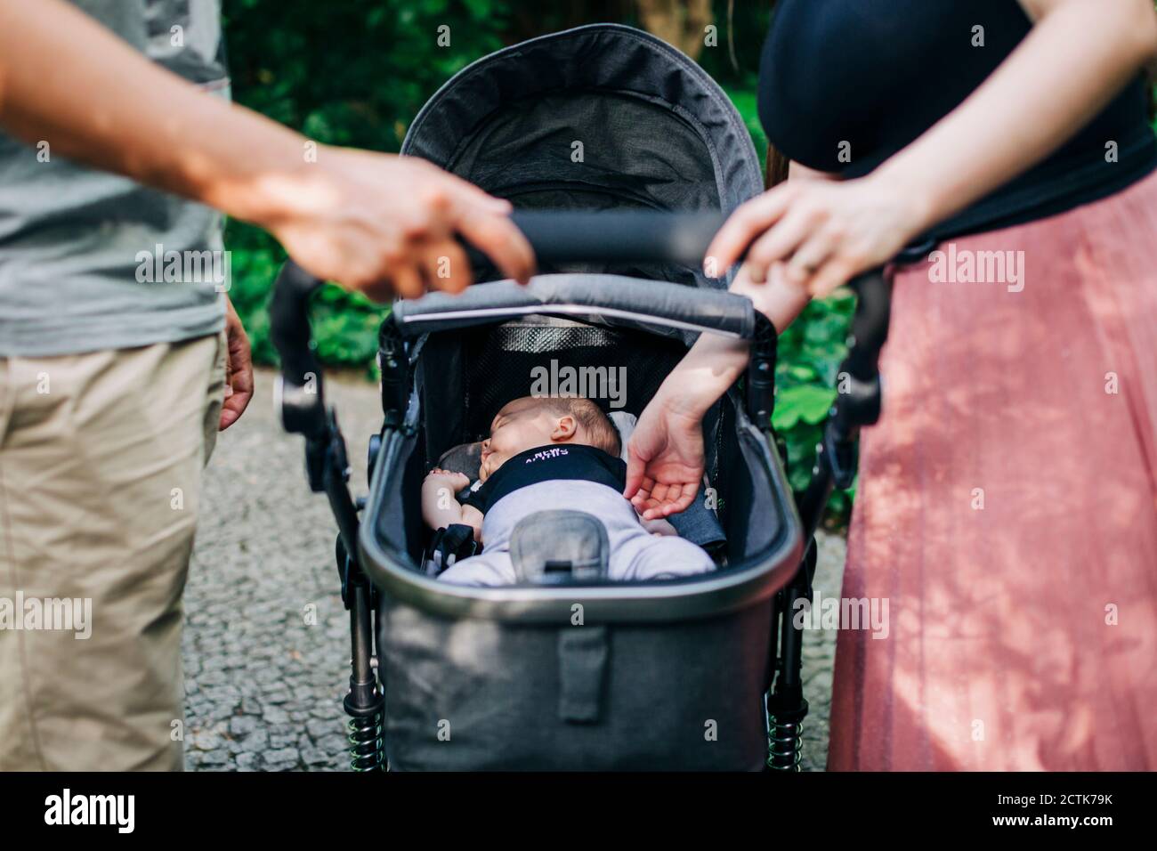 Babies sleeping in the baby carriage hi-res stock photography and ...