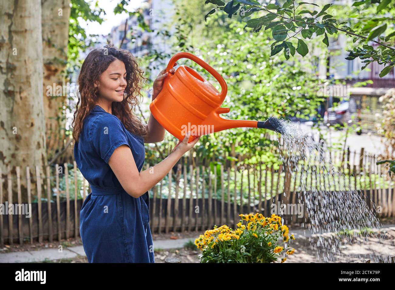 Garden watering flowers hi-res stock photography and images - Alamy