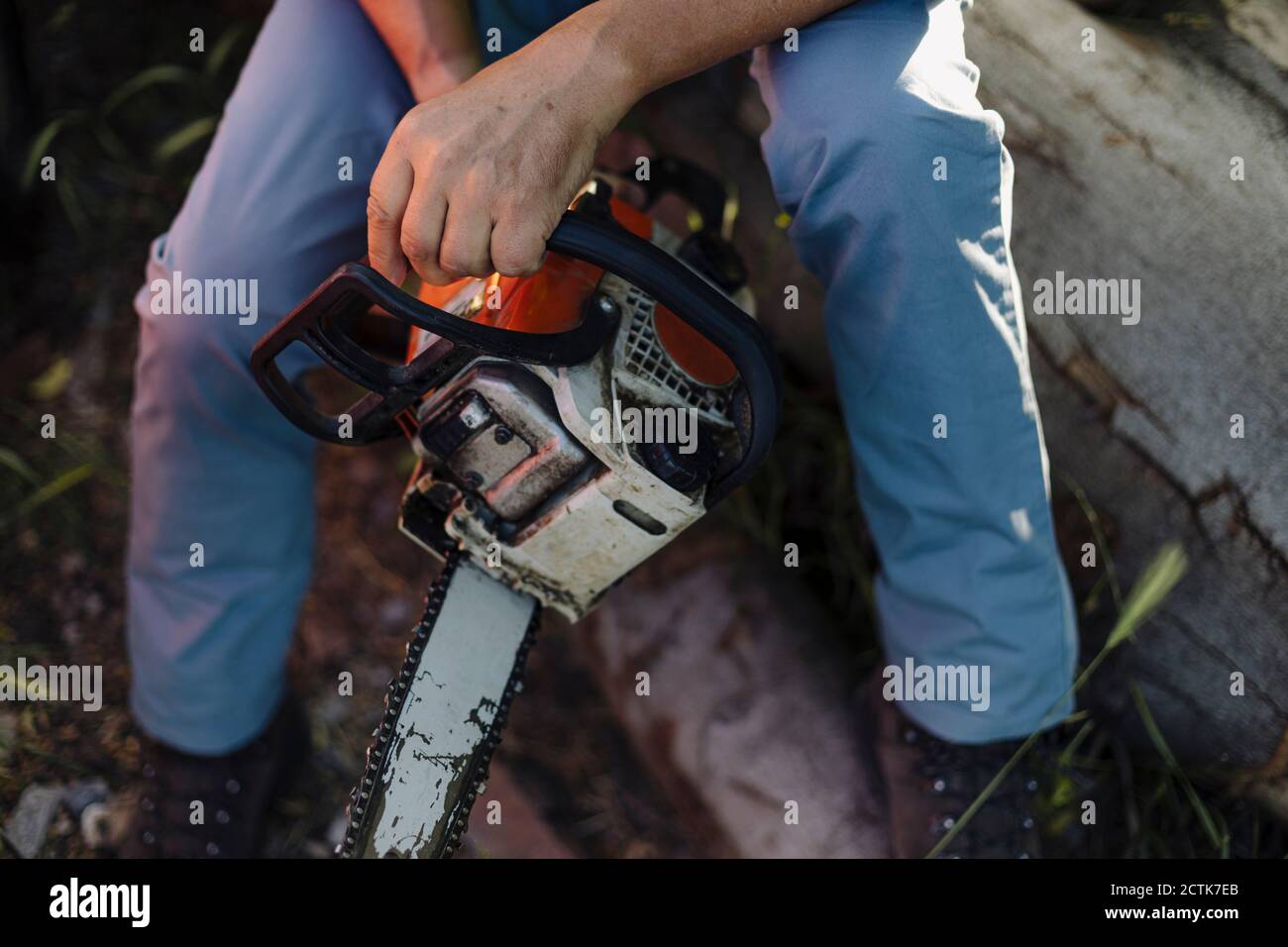 Man holding chainsaw hi-res stock photography and images - Alamy