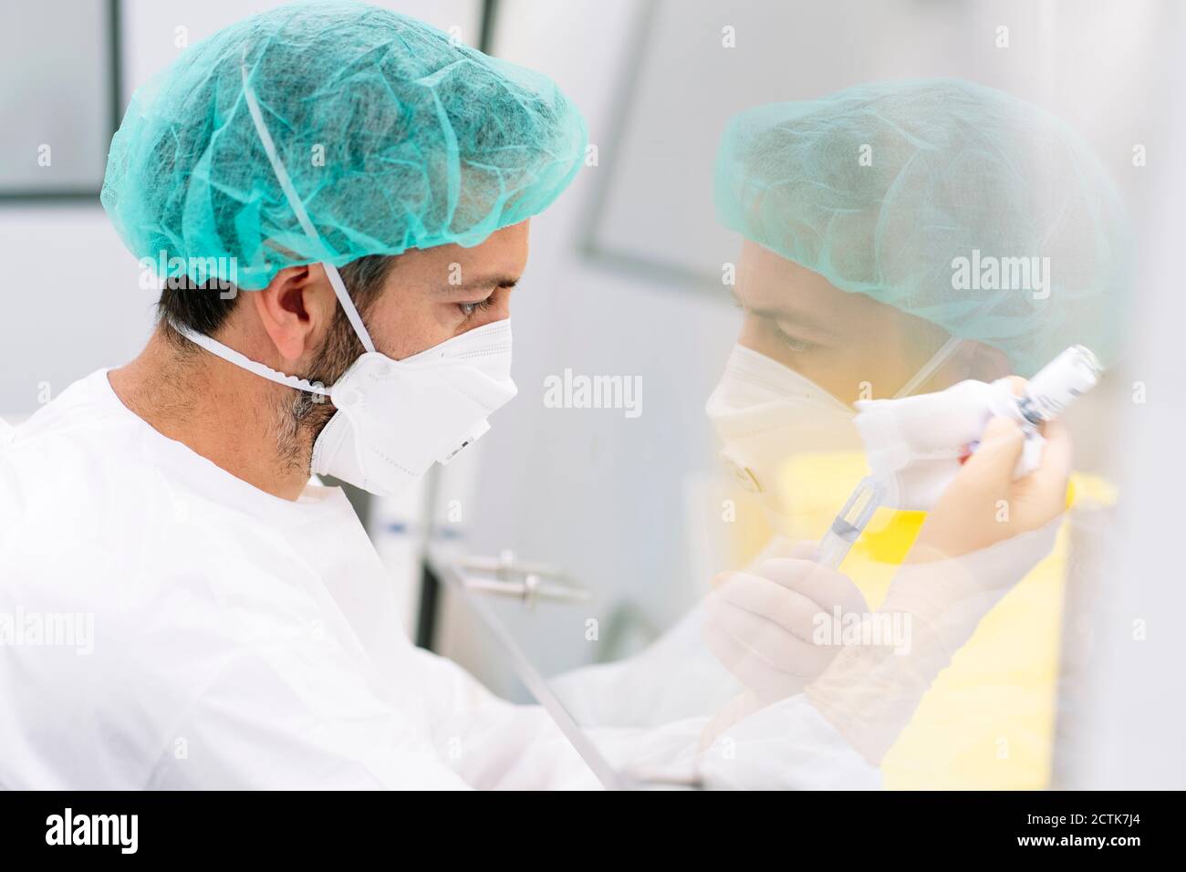 Close-up of male pharmacist making medicines in laboratory Stock Photo ...