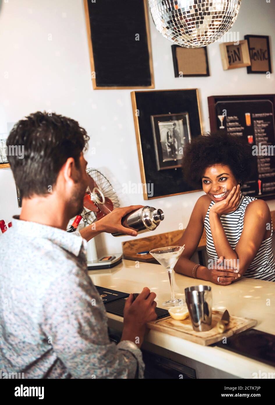 Woman looking at two men flirting bar hi-res stock photography and ...