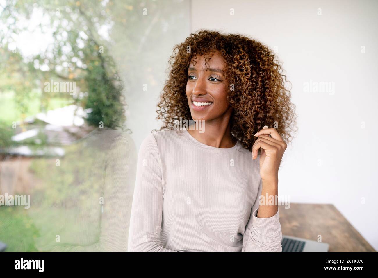 Female in window hi-res stock photography and images - Alamy