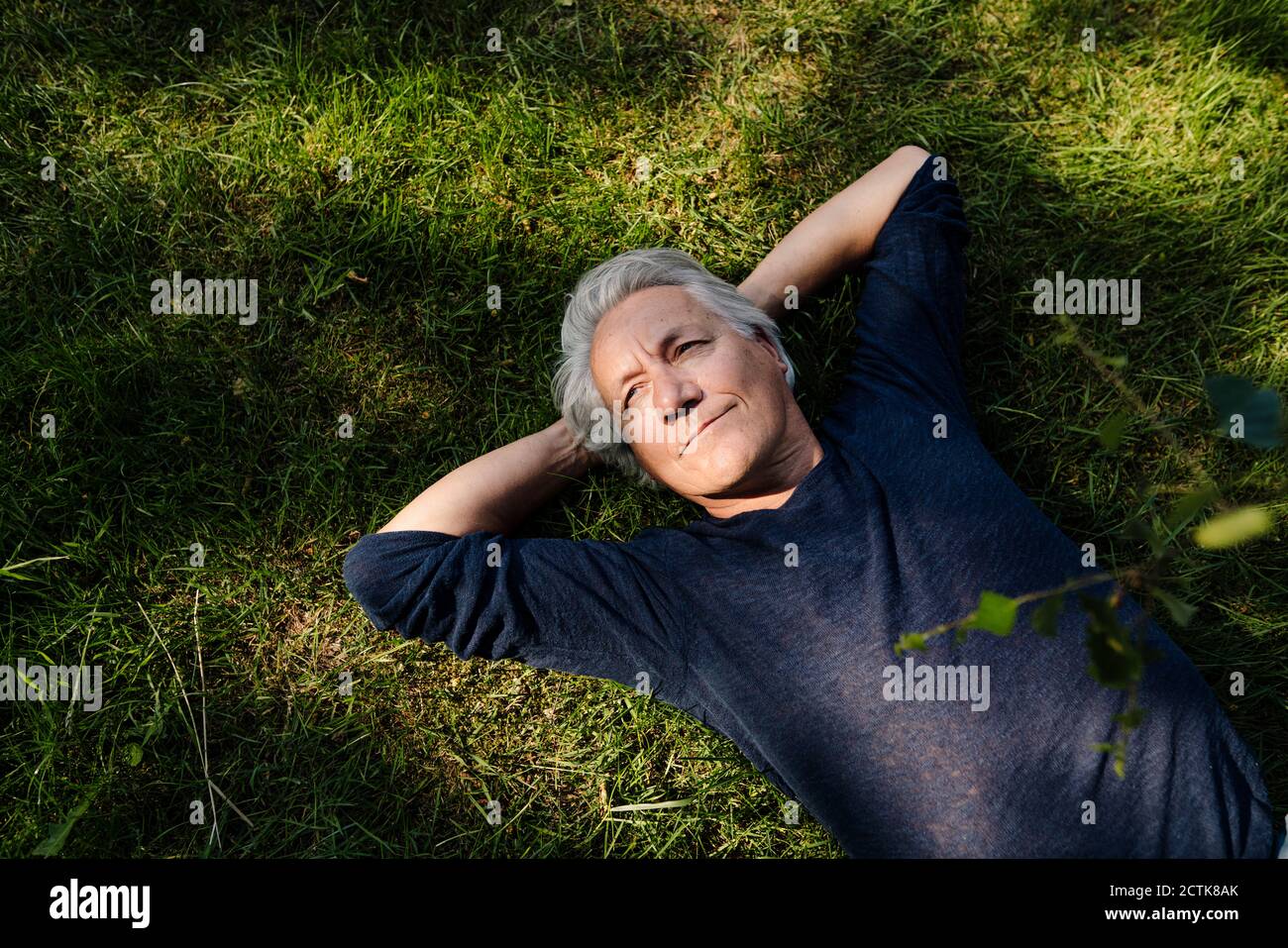 Man lying down hi-res stock photography and images - Alamy