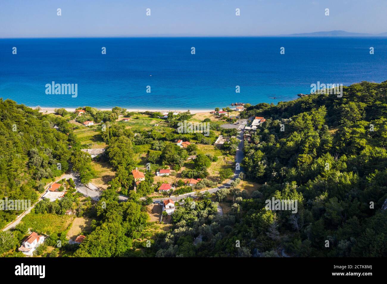 Aerial view of houses on shore of Samos island with Potami Beach in ...