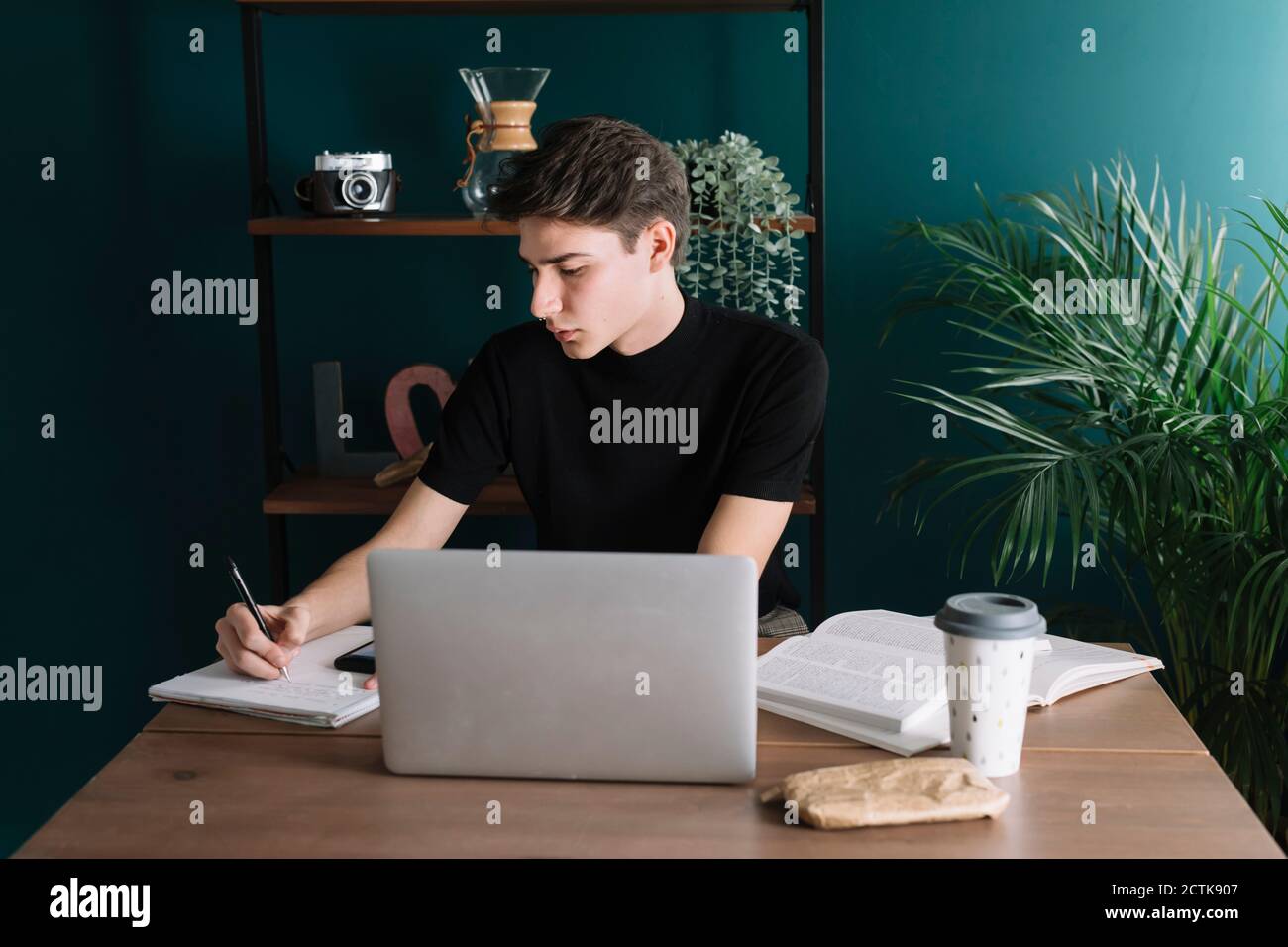 Man writing in book hi-res stock photography and images - Alamy