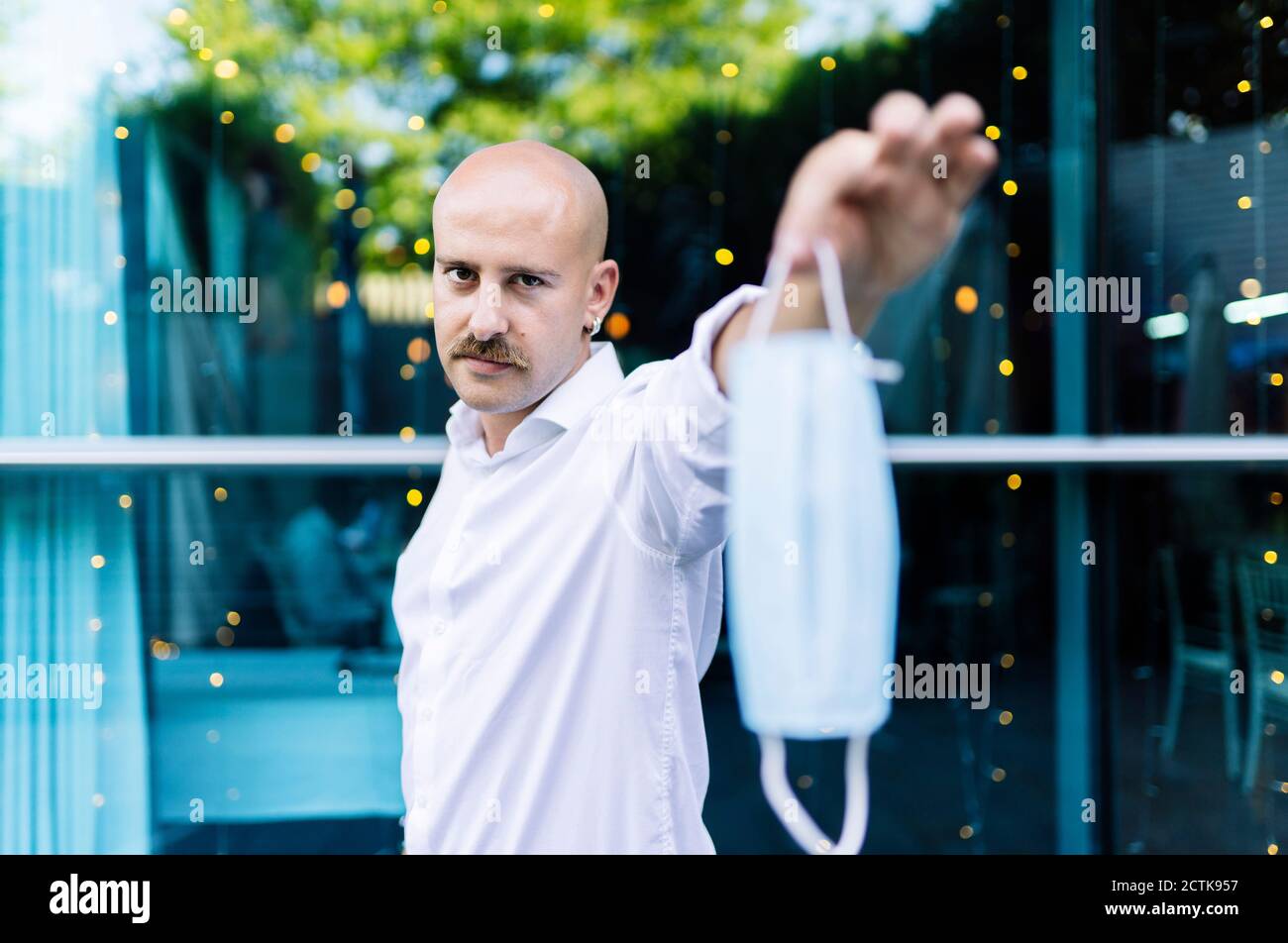 Man holding mask face hi-res stock photography and images - Alamy