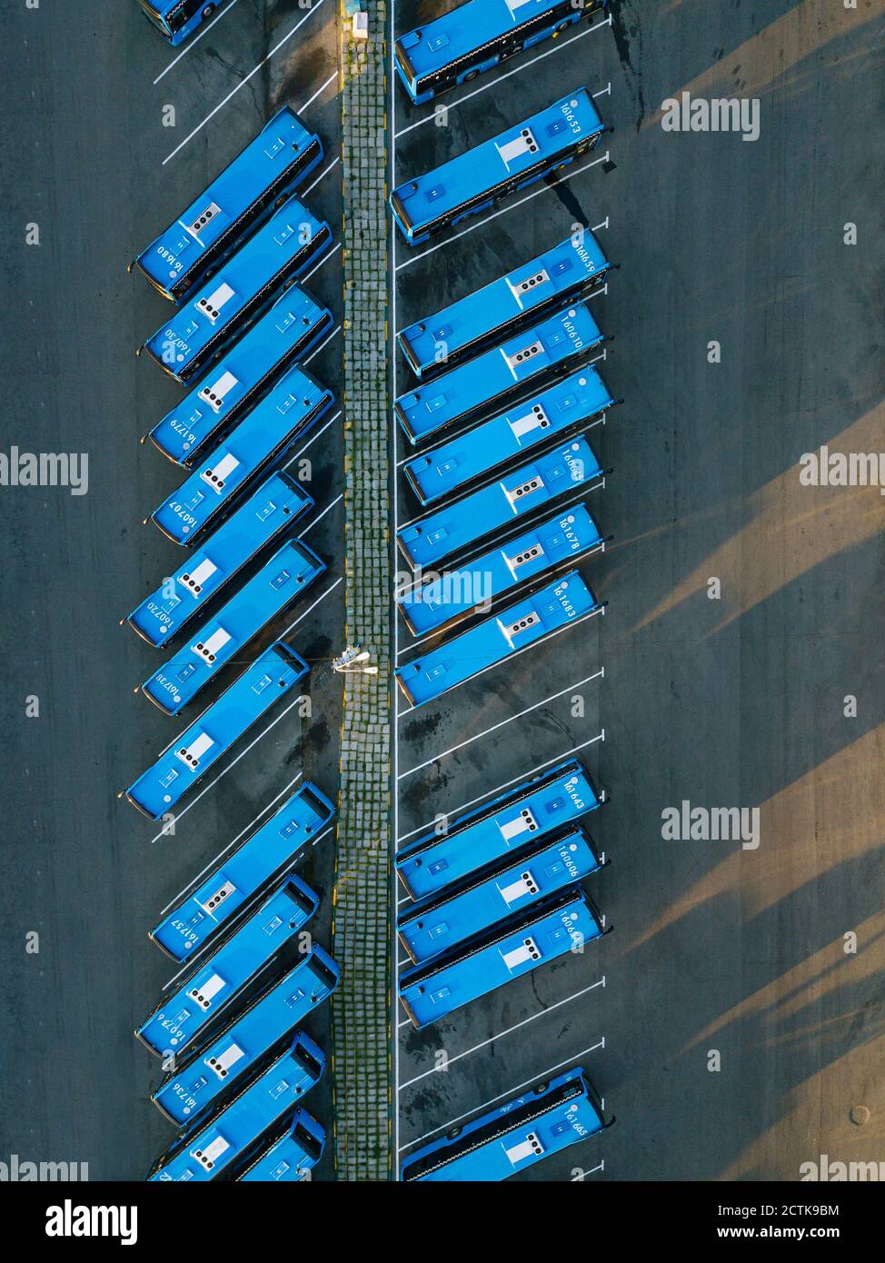 Aerial view of parking lot filled with blue buses Stock Photo - Alamy