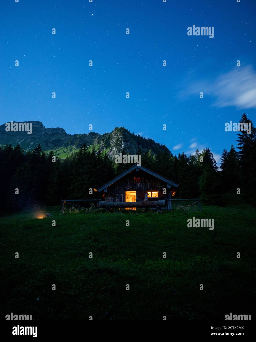 Secluded mountain hut at night Stock Photo - Alamy