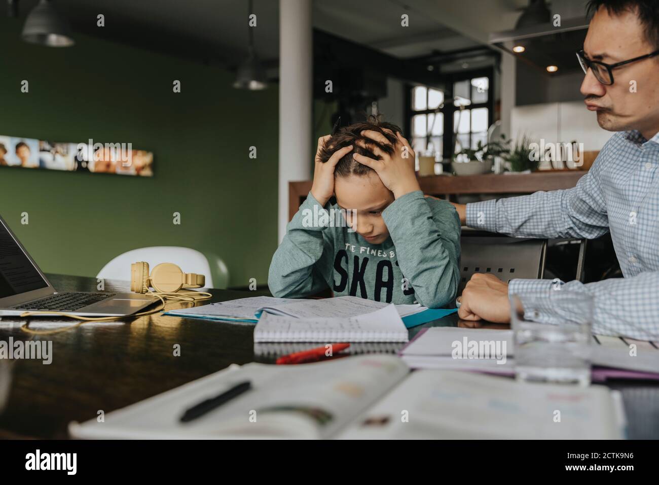 Father consoling son having problems with his homework Stock Photo - Alamy