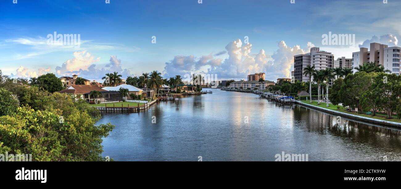 Golden hour Blue sky and clouds over the Vanderbilt Channel river near ...