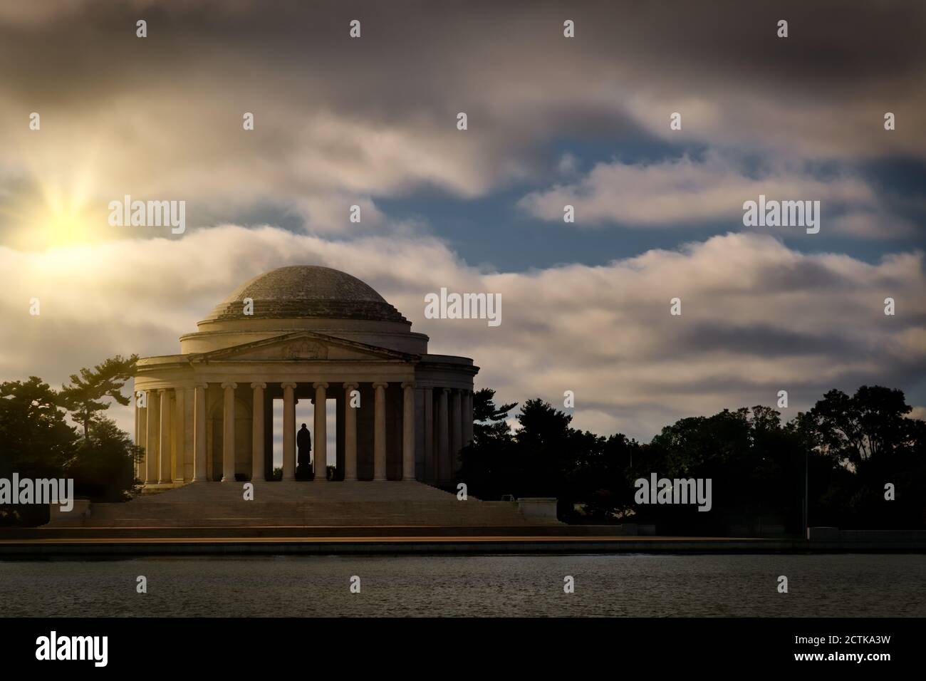 The sun breaks out behind the clouds at the Jefferson Memorial in ...