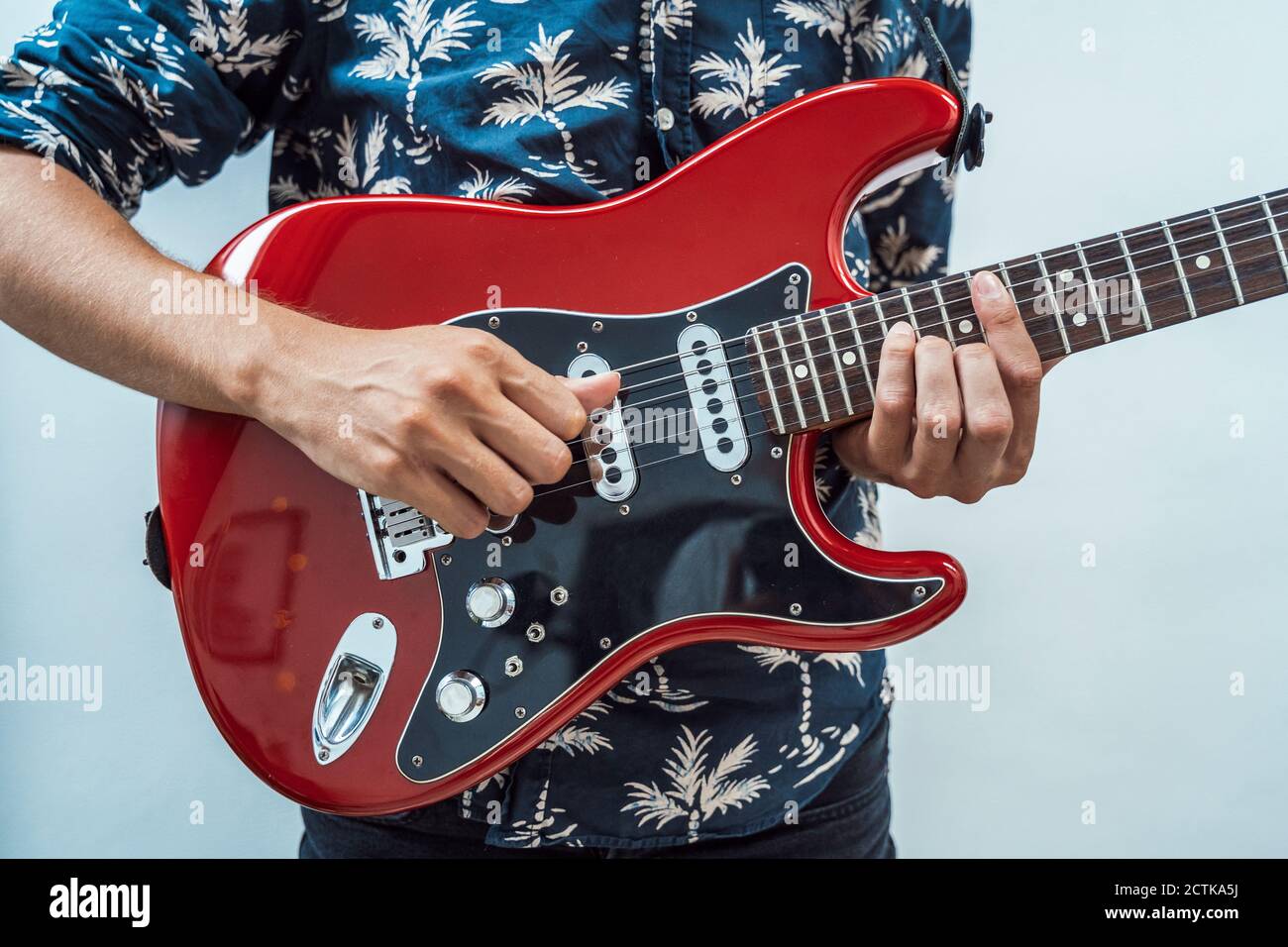 Man standing wall playing guitar hi-res stock photography and images ...
