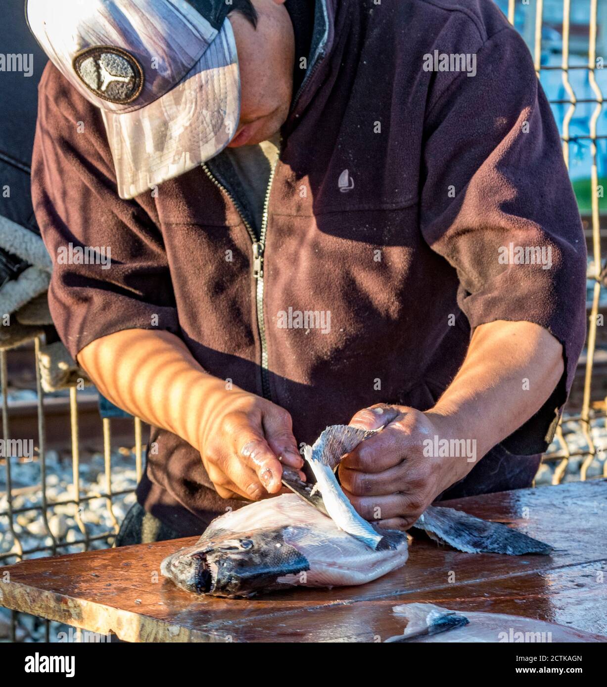 Valparaiso, Chile - 2019-07-30 - Fisherman filets freshly caught fish ...