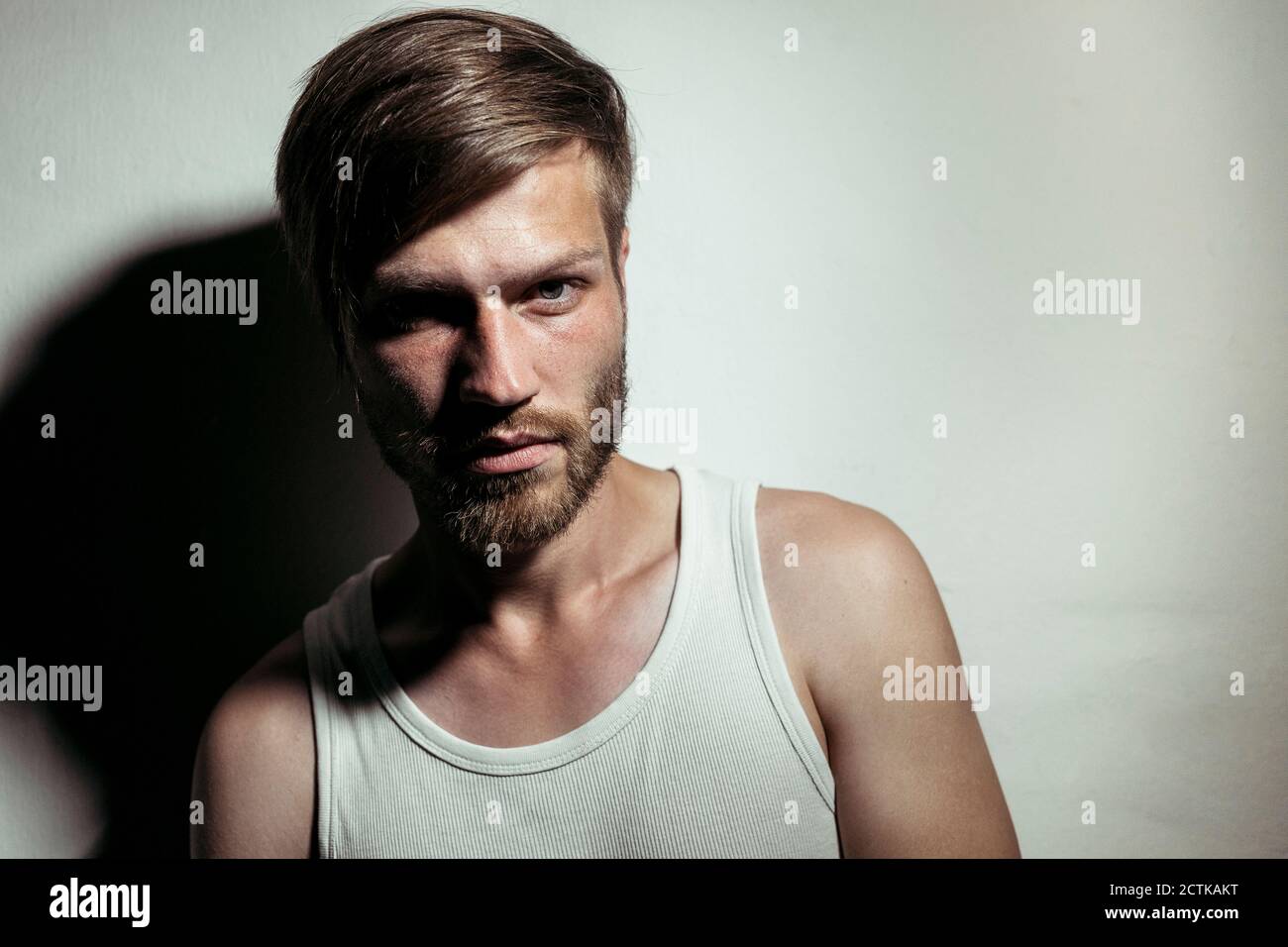 Handsome man beard staring against white background Stock Photo - Alamy