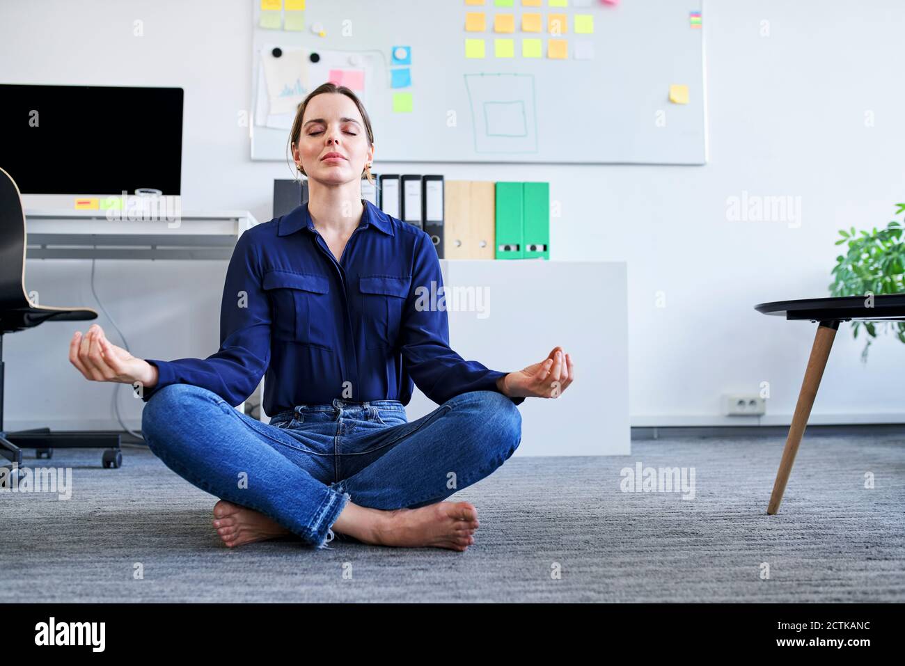 Professional meditating at work hi-res stock photography and images - Alamy