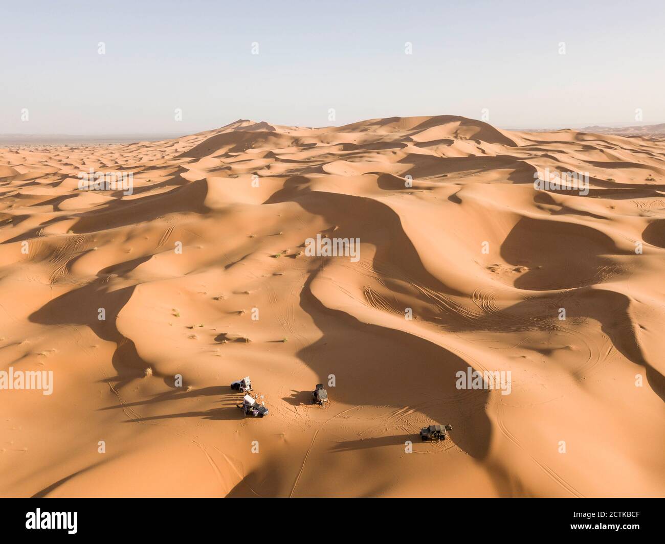 Off-road cars in vast barren desert Stock Photo - Alamy