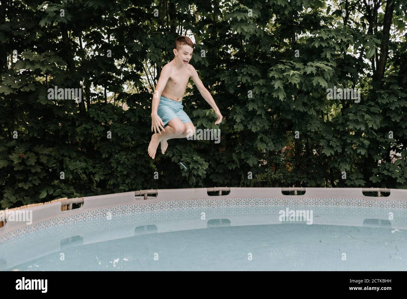 Boy jumping joy outdoors hi-res stock photography and images - Alamy