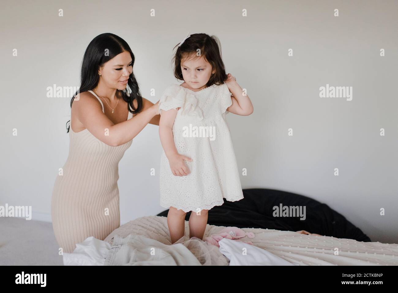 Woman getting dressed in bedroom hi-res stock photography and images ...