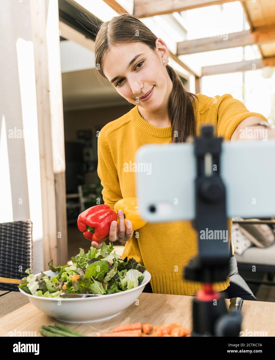 Woman filming food vlog smartphone hi-res stock photography and images ...