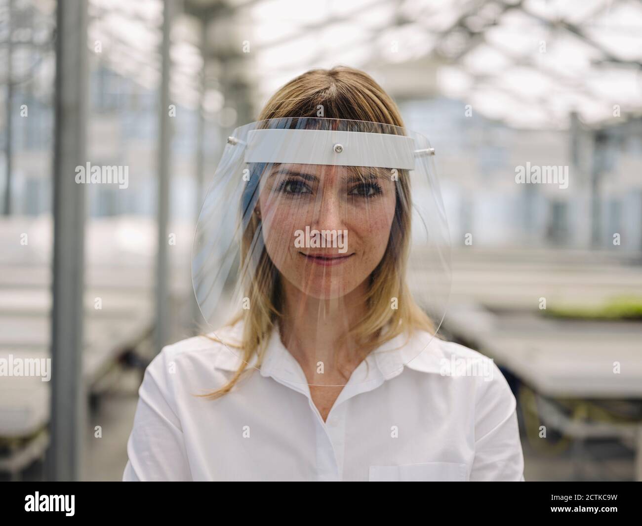 Wearing face shield hi-res stock photography and images - Alamy