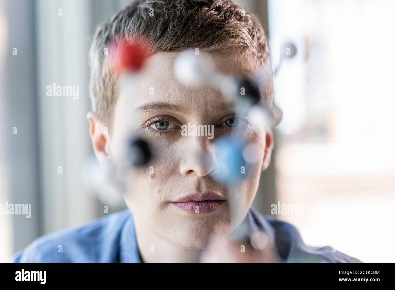 Portrait of woman with molecule model Stock Photo - Alamy