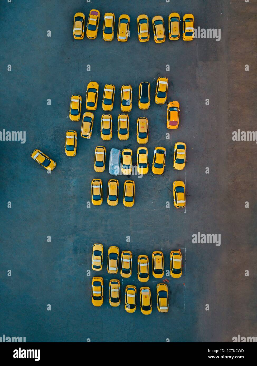 Aerial view of yellow cars parked in parking lot Stock Photo - Alamy