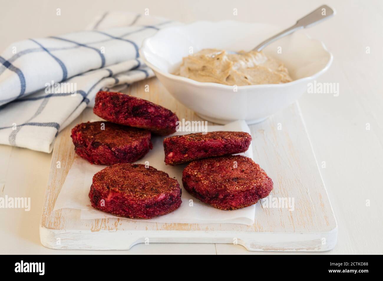 Amaranth-beetroot thalers with sesame dipping sauce Stock Photo - Alamy