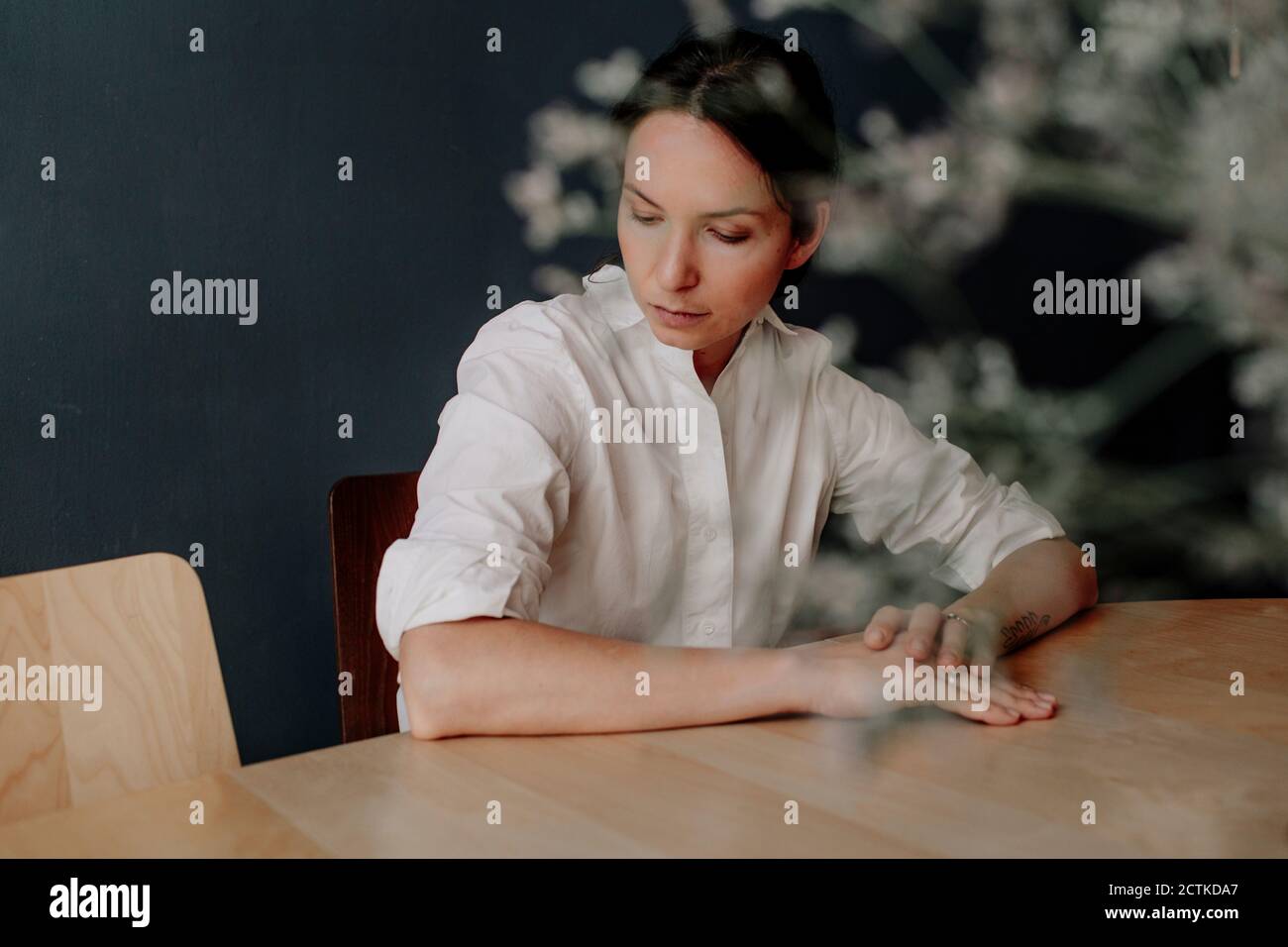 Woman at table in restaurant hi-res stock photography and images - Alamy