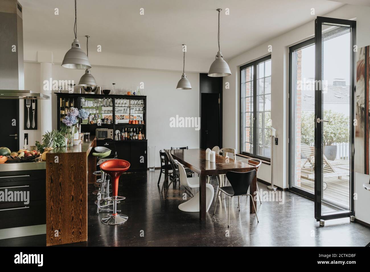 Dining area in a designer loft Stock Photo - Alamy