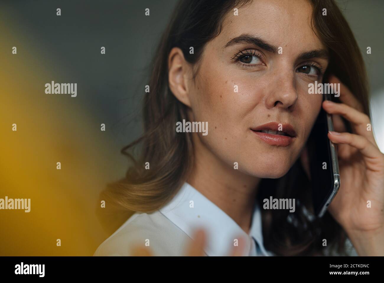 Young woman talking on mobile hi-res stock photography and images - Alamy