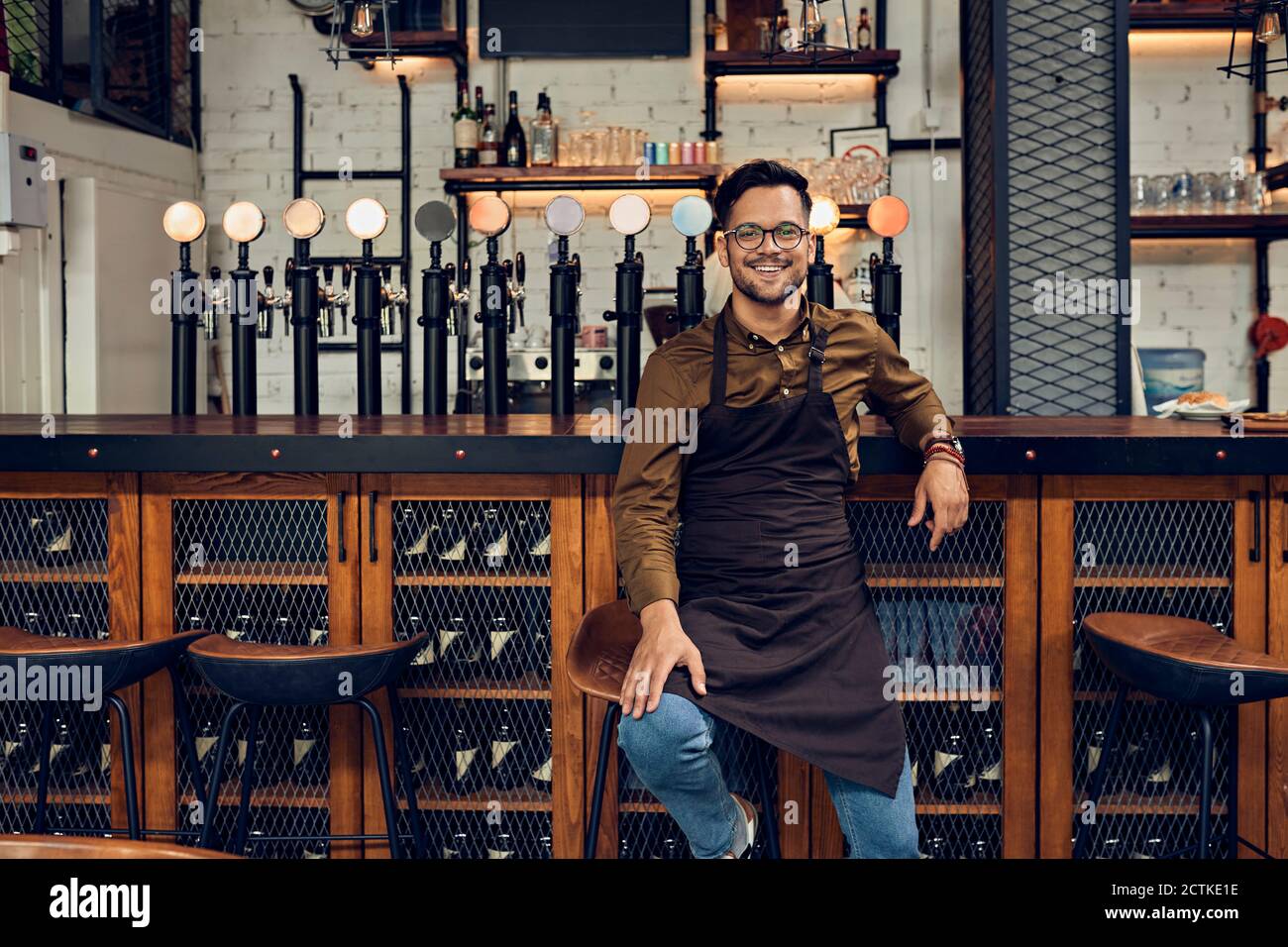 Happy friends socializing in a pub Stock Photo - Alamy