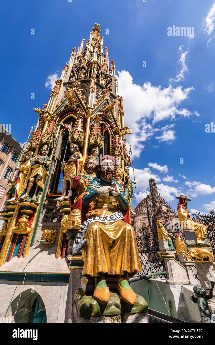 Germany, Bavaria, Nuremberg, Sculptures of historical Schoner Brunnen ...