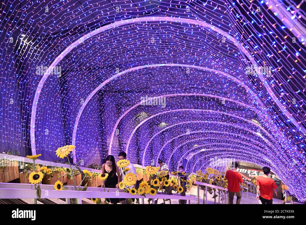 View of the LED-lighted rainbow tunnel at a subway station in Nanning ...